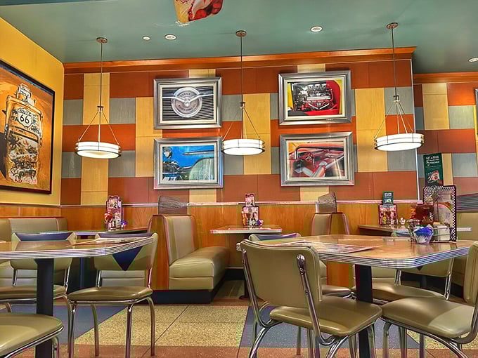Warm wood tones, colorful checkerboard walls, and classic car memorabilia create the perfect backdrop for breakfast conversations that last until lunch.