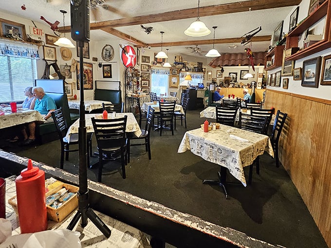 Step inside and time slows down. Vintage memorabilia covers every wall, tablecloths tell stories, and that ketchup bottle stands ready for action.