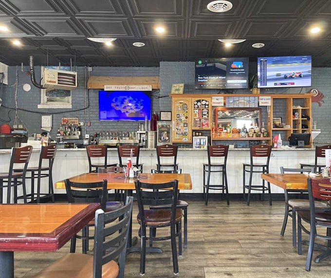 Inside, the bar area offers front-row seats to the seafood action. Those ceiling tiles have witnessed countless "Oh my God" first-bite moments.