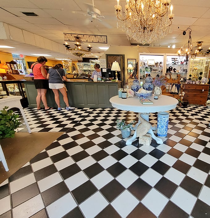 Crystal chandeliers hover above a classic checkered floor—because hunting for vintage treasures should always feel this glamorous.