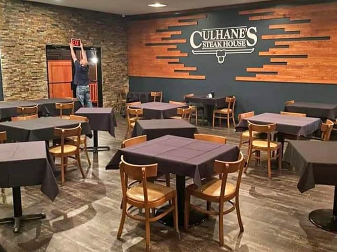 Where magic happens: Simple wooden chairs and black tablecloths set the stage for the real star—what's about to arrive on your plate.