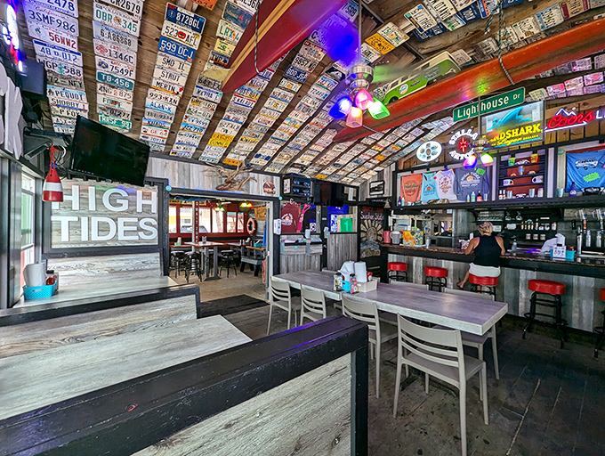 License plates from across America create a ceiling mosaic that tells stories of road trips and vacations past. Florida beach dining at its most authentic.