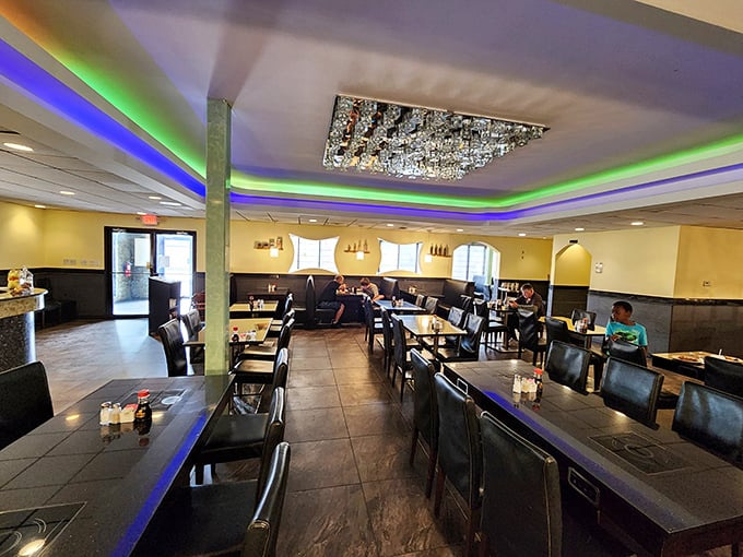 Beneath colorful LED lighting and a crystal chandelier, diners enjoy their feast in modern surroundings that feel surprisingly upscale for a buffet experience.