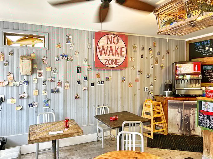The "No Wake Zone" sign isn't just decoration – it's a philosophy. Slow down, savor your meal, and enjoy the fishing memories covering the walls.
