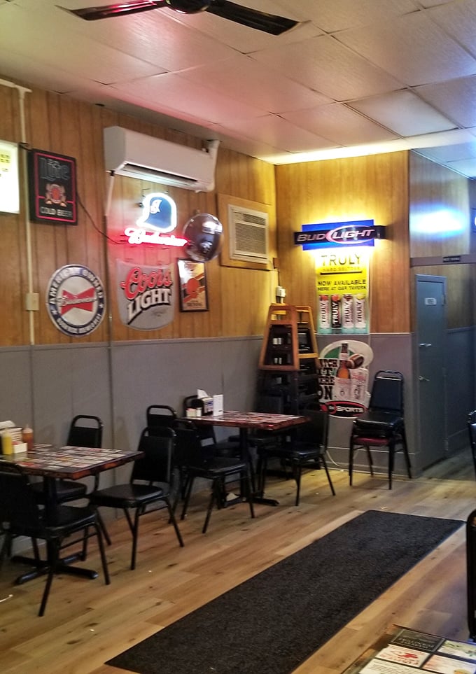 Classic wood paneling, neon beer signs, and simple tables create the perfect no-frills backdrop for a culinary revelation. This isn't Instagram bait—it's authenticity.
