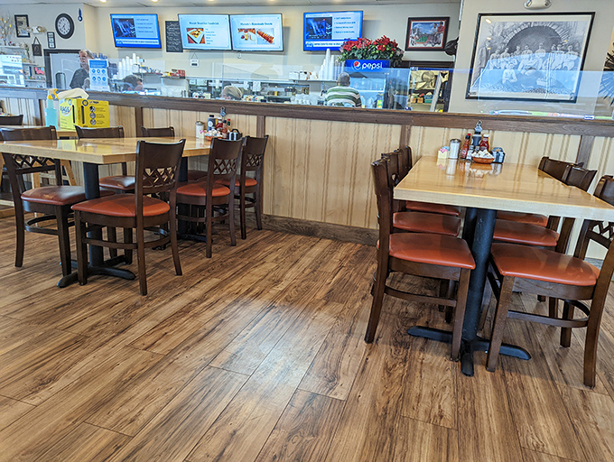 Simple wooden tables and chairs invite you to sit, stay, and savor. No pretension here—just the promise of honest food in a space that feels like coming home.