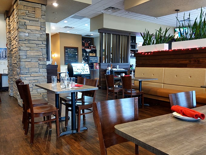 Stone columns and warm wood tones create that perfect sweet spot between "special occasion" and "Tuesday night dinner." The dining area invites lingering conversations.