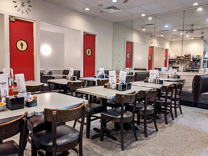 Red doors, classic booths, and the promise of comfort food—stepping inside feels like walking onto the set of your favorite diner scene.