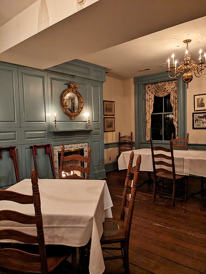 Blue-painted woodwork frames a dining room where history and hunger meet. Those ladder-back chairs have probably heard more fascinating conversations than most therapists.