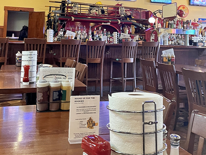 The bar's centerpiece—an actual fire truck—proves that whoever said "don't play with your food" never considered "don't play with fire trucks."