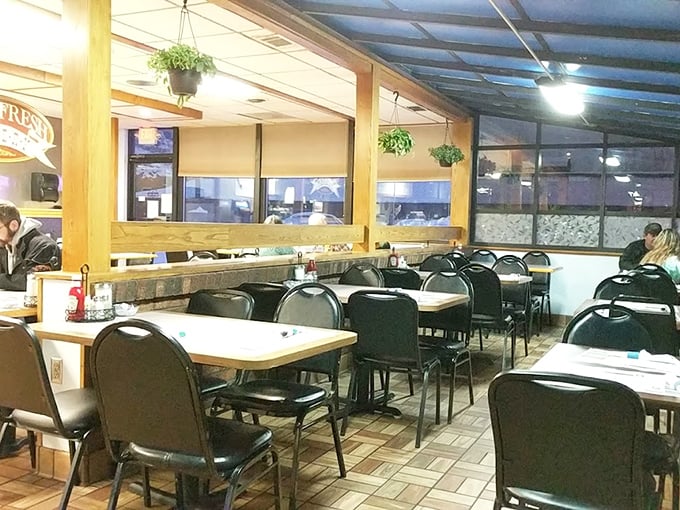 Classic diner ambiance with hanging plants and comfortable seating – where conversations flow as freely as the coffee and nobody's checking their Instagram.