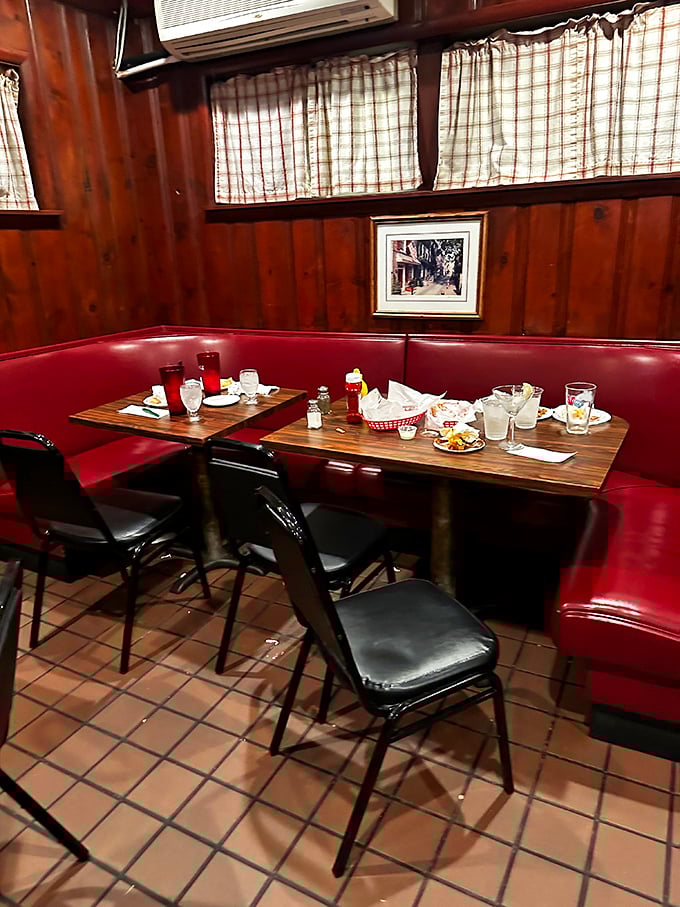 Red vinyl booths cradle decades of conversations and comfort food memories. Wood-paneled walls don't whisper trendy—they shout timeless Pennsylvania tavern tradition.