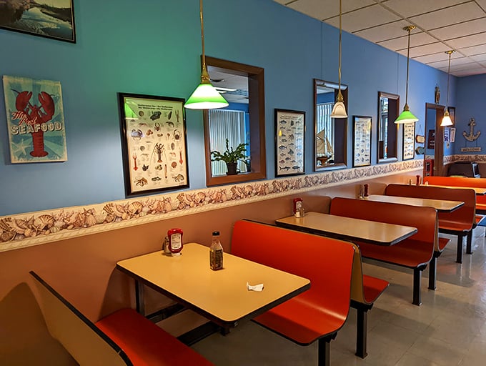 Nautical blue walls, classic diner booths, and seafood-themed decor create the perfect unpretentious atmosphere for serious seafood enjoyment.