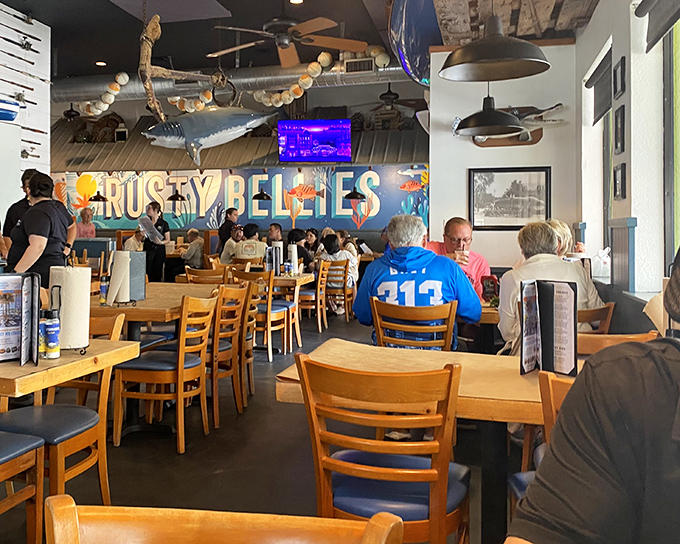 Inside, wooden tables and nautical décor create the perfect backdrop for seafood feasting, while a giant fish watches over diners.