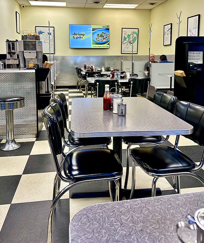 Classic black and white checkered floors set the stage for breakfast theater, where every chrome-edged table is front row seating.