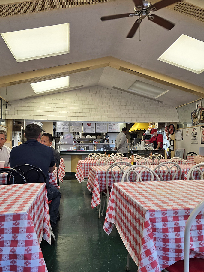 Red and white checkered tablecloths set the stage for unpretentious dining—where conversations flow as freely as the coffee in this Nashville institution.