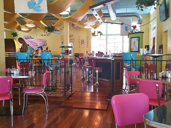 Retro meets rainbow inside with turquoise and pink chairs that don't just invite you to sit—they dare you not to smile.