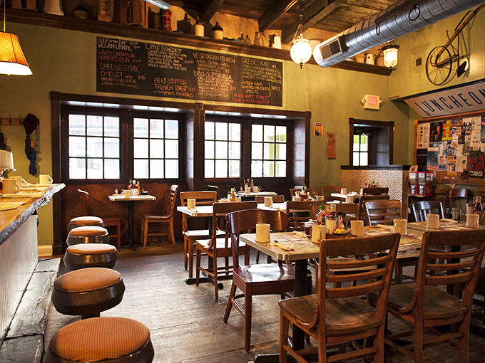 Wooden chairs, warm lighting, and that chalkboard menu – this isn't just a restaurant, it's a time machine to when comfort food actually comforted.