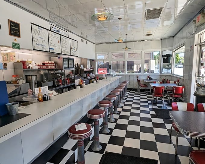 Classic Americana in black and white tiles with a splash of red vinyl. This isn't retro by design—it's authentic by survival.