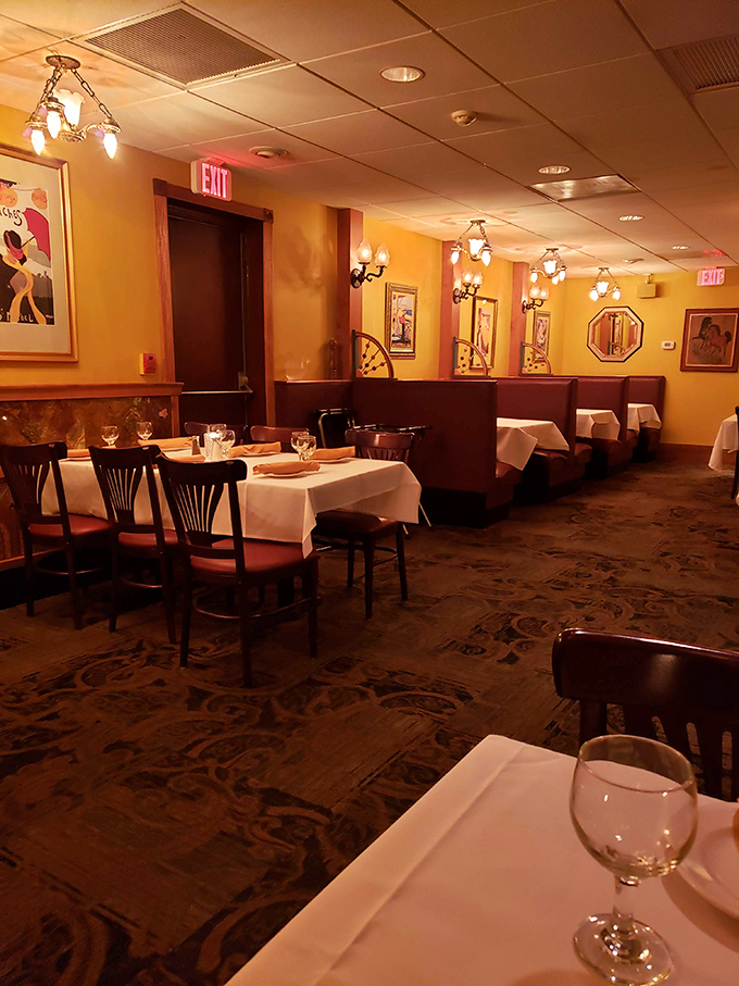 Warm yellow walls, white tablecloths, and vintage art create that perfect "I've just discovered my new favorite place" ambiance.