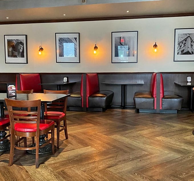 Red leather booths and warm wood floors create that perfect "Cheers" vibe—where everybody might not know your name yet, but they'll remember your order.