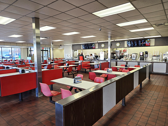 Red booths and no-nonsense counters—this isn't retro by design, it's authentic by survival. Burger history preserved in its natural habitat.