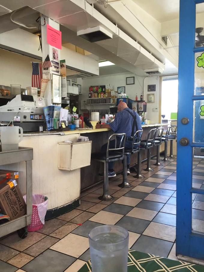 Counter seating at Frank's offers front-row tickets to the culinary show, where regulars perch on chrome stools that have witnessed decades of breakfast conversations.