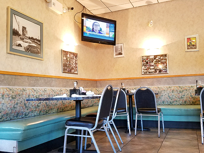 Teal vinyl booths and local memorabilia create that perfect "been-here-forever" vibe where comfort begins before the food even arrives.