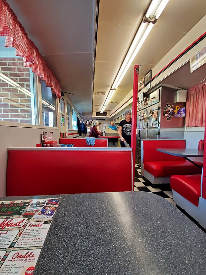 Classic red vinyl booths and checkered floors – this isn't interior design, it's time travel with the bonus of incredible food.
