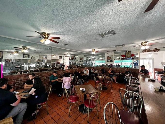 Inside, the classic diner aesthetic – ceiling fans, brick dividers, and well-worn tables – creates the perfect stage for food that outshines any fancy decor.