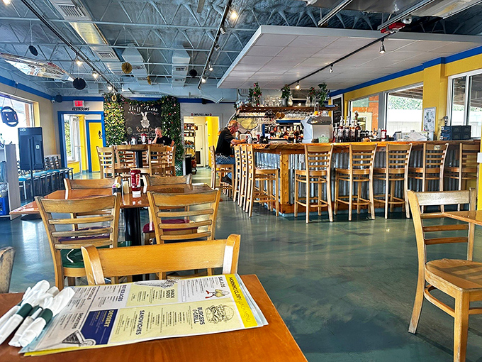Bright yellow walls and blue ceiling create a cheerful atmosphere that says "wake up and smile!" The wooden chairs practically beg you to settle in for the long haul.
