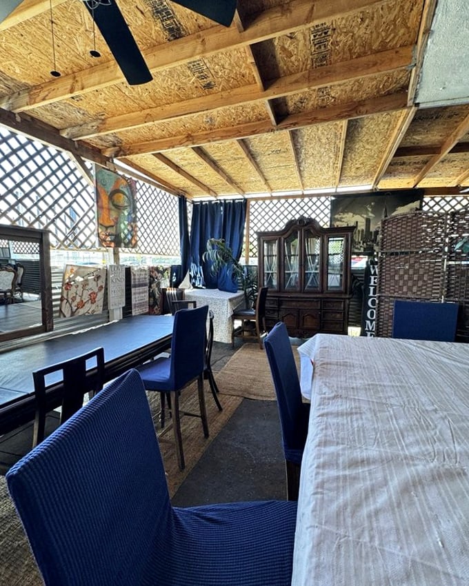 Rustic wooden beams and lattice screens create a cozy dining sanctuary. Somewhere between your favorite aunt's porch and a Southern hideaway.