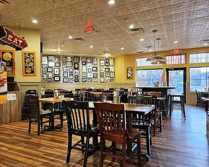 Yellow walls adorned with framed memories and mismatched wooden chairs create that "grandma's kitchen meets cool hangout" vibe every great deli needs.