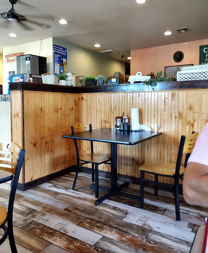 Inside, warm wood paneling and simple furnishings let you know priorities are straight—all energy goes to the food, not fancy decor.