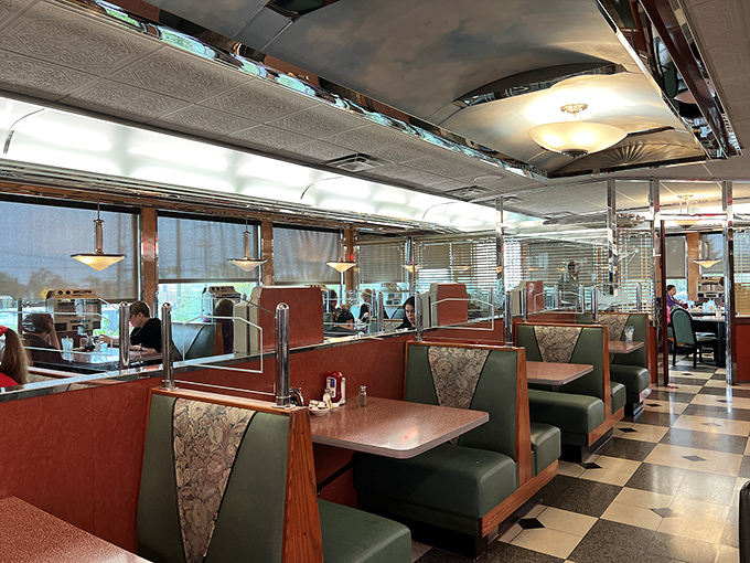 Sliding into these green vinyl booths feels like coming home. The checkerboard floor and chrome details aren't retro—they're timeless.