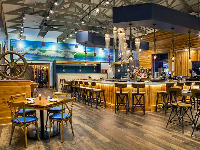 Nautical elegance without the kitsch. The warm wood, ship's wheel, and ocean-blue accents create the perfect backdrop for seafood indulgence.
