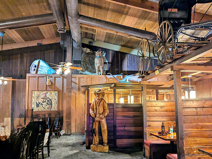 Step inside and you're transported to the Old West, complete with wagon wheels overhead and a wooden cowboy standing guard over your dining experience.