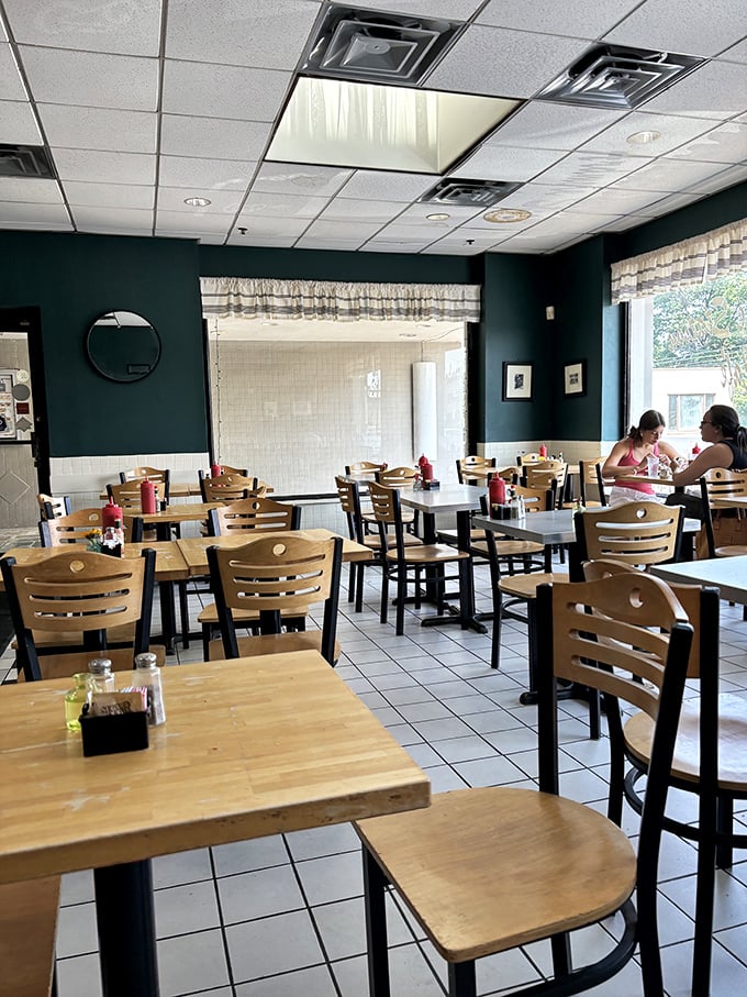 Deep green walls and wooden chairs create that "everybody knows your breakfast order" vibe that's increasingly rare these days.