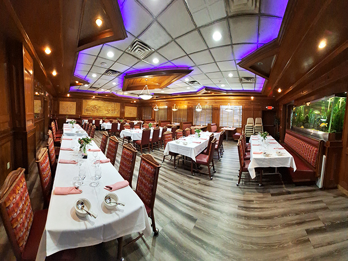 Step inside to discover an unexpected touch of elegance – white tablecloths and ambient lighting transform this classic diner into something that feels special without being stuffy.