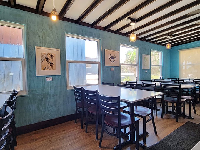 Seafoam walls and wooden beams create the perfect "I'm definitely at the beach" vibe. Simple, clean, and ready for the main attraction—the food.