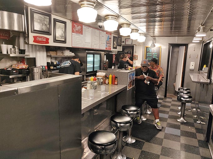 Where strangers become friends over sizzling patties. The classic counter setup isn't retro by design—it simply never needed changing.