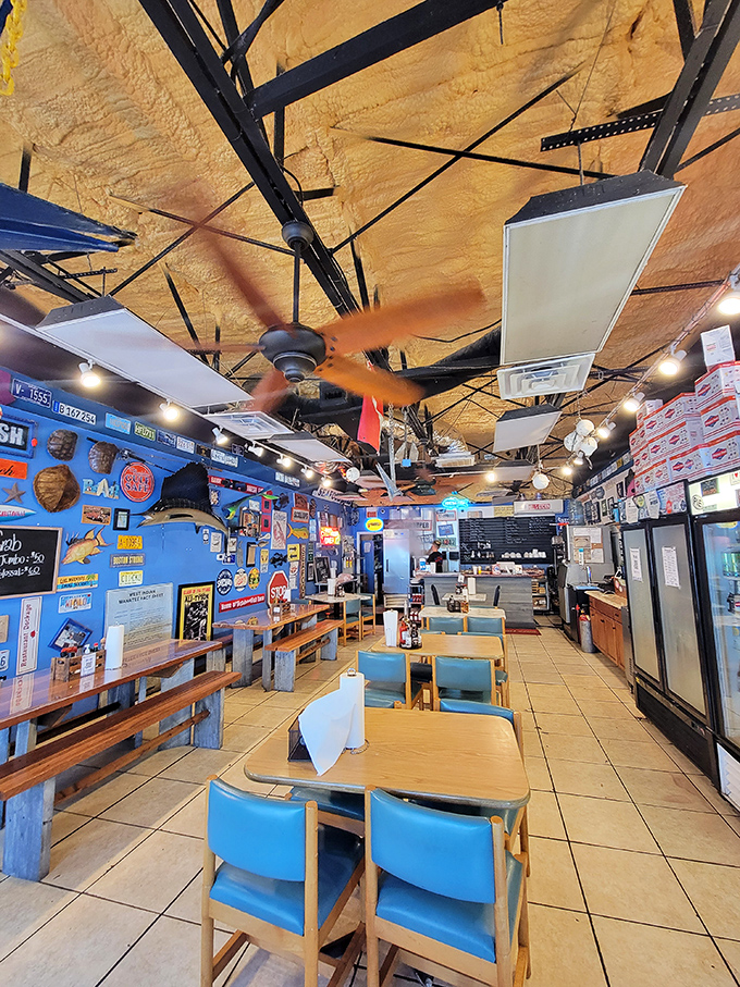 Inside, it's Florida seafood heaven—vibrant blue walls adorned with maritime memorabilia, ceiling fans lazily spinning overhead, and the promise of fresh catches awaiting.