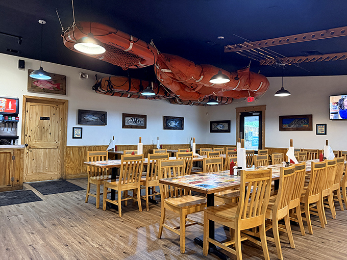 Fishing nets suspended from the ceiling aren't just decoration—they're a promise of the authentic maritime experience waiting at your wooden table. 