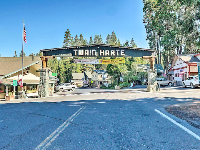 Main Street under clear blue skies – where rush hour means three cars waiting for a family of deer to cross the road.