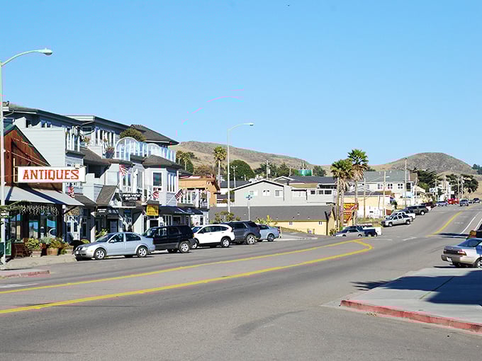 Main Street Cayucos – where "rush hour" means three cars waiting at the town's only stoplight and nobody minds one bit.