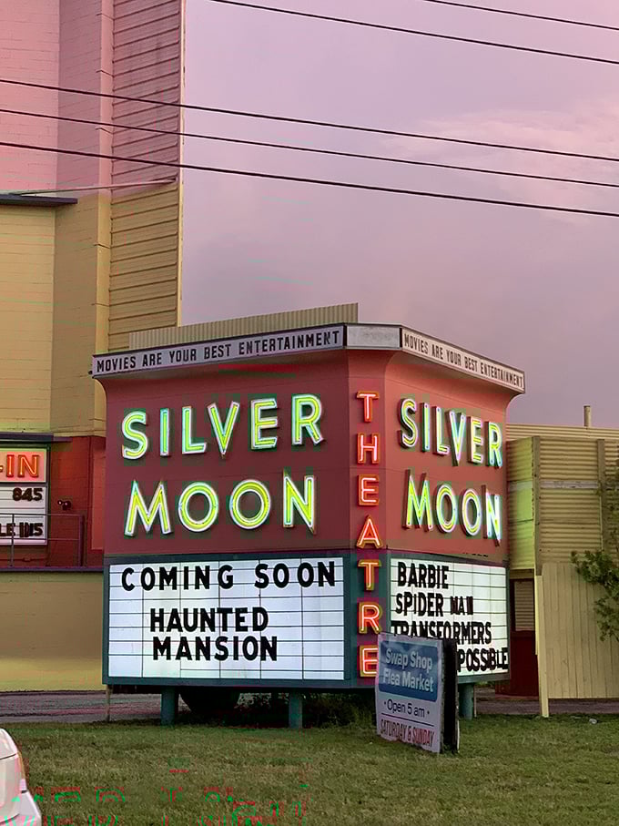 That neon glow! Silver Moon's iconic marquee promises "Haunted Mansion" and more, a beacon of nostalgia in neon pink against the twilight sky.