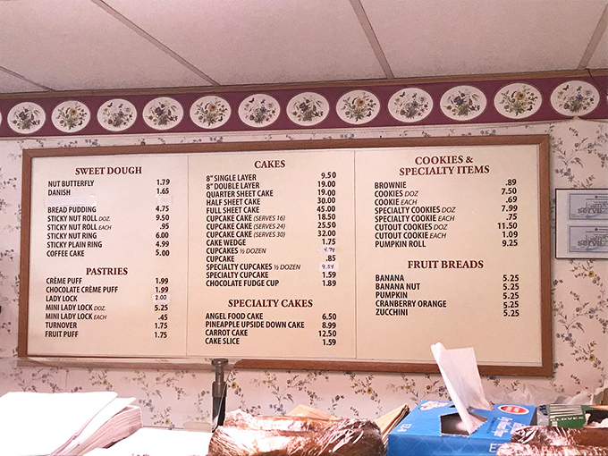 This menu board is like reading a love letter to carbs – from sticky nut rolls to fruit pies, each item represents a different way to experience pure joy.