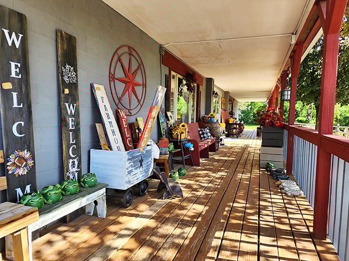Dappled sunlight plays across the welcoming porch, where rustic signs and vintage decor offer the first hints of wonders within.