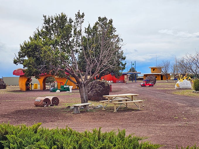 A peaceful oasis in the desert where dinosaurs roam and picnic tables invite weary travelers to rest their bones.