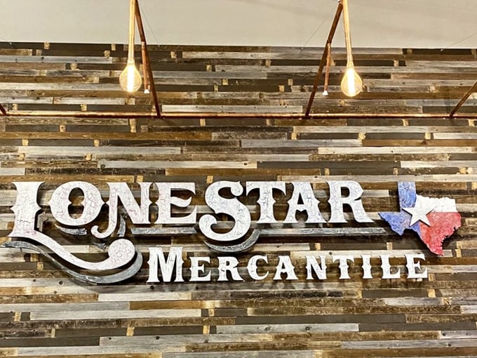 More than just a sign—it's a promise of treasures to come, mounted on a reclaimed wood wall that's a preview of the rustic aesthetic inside.